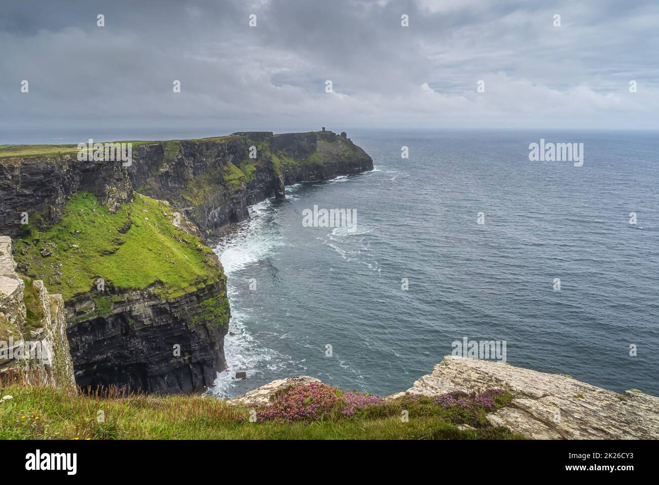 Iconic Cliffs of Moher with Moher Tower on far distance, Ireland Stock ...