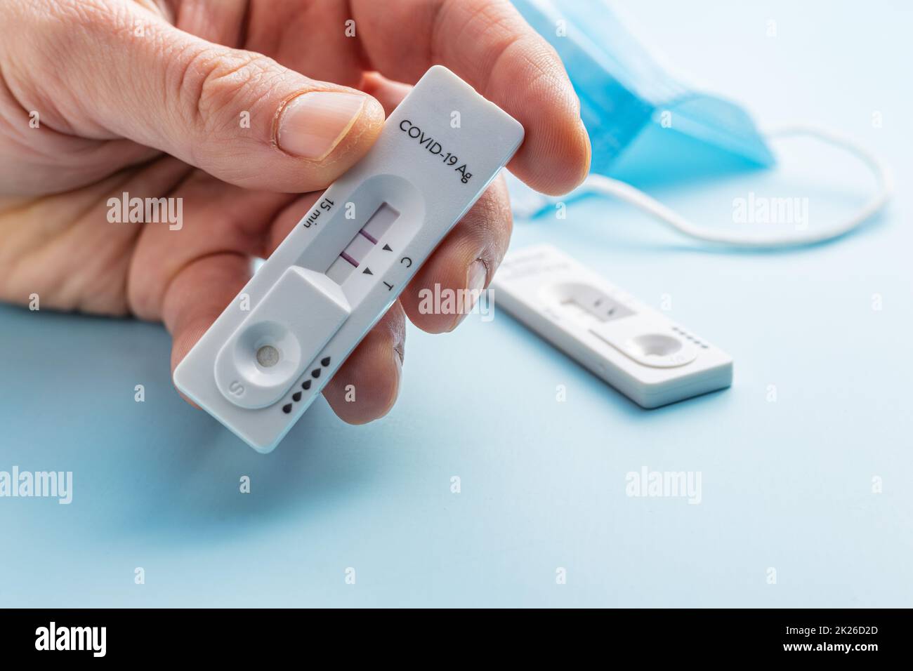 Positive Covid-19 antigen test in hand. Coronavirus antigen rapid test ...