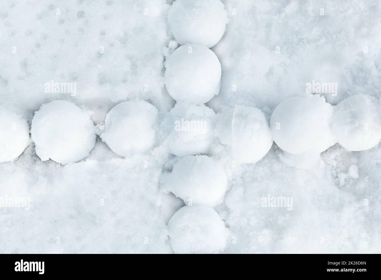Group of snowballs on a textured snow background Stock Photo - Alamy