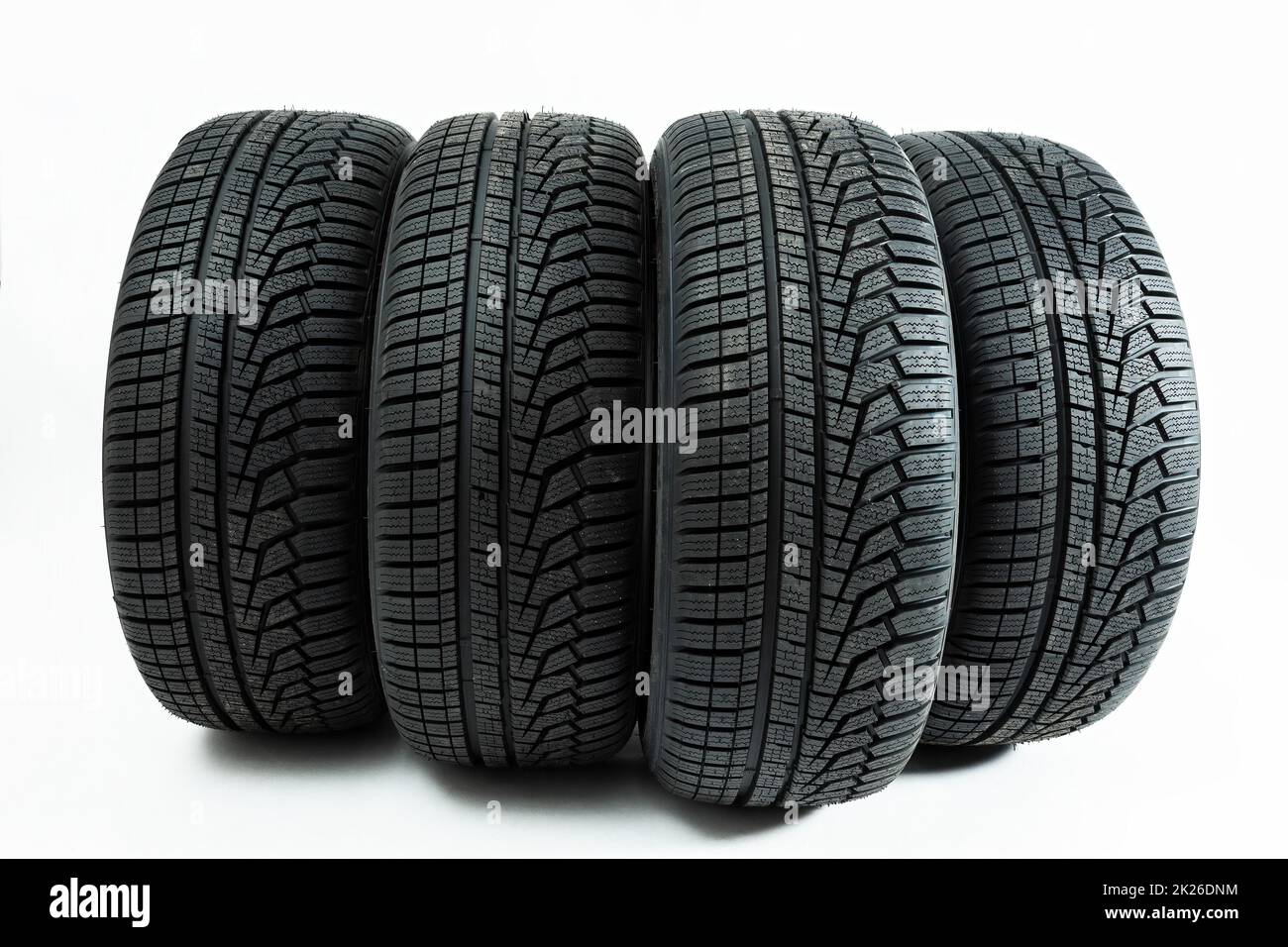 Winter tires rolling forward isolated on white background Stock Photo ...
