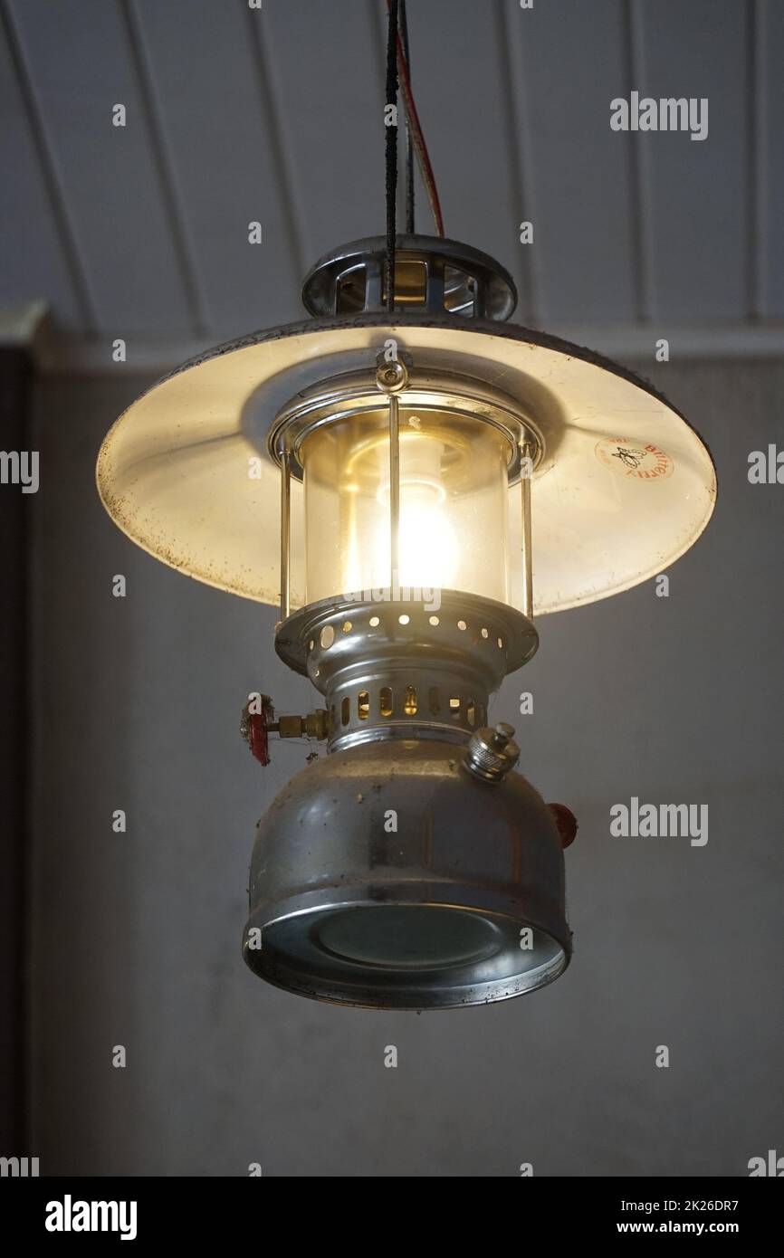 classic vintage Storm lanterns light on the coffee shop wall Stock ...