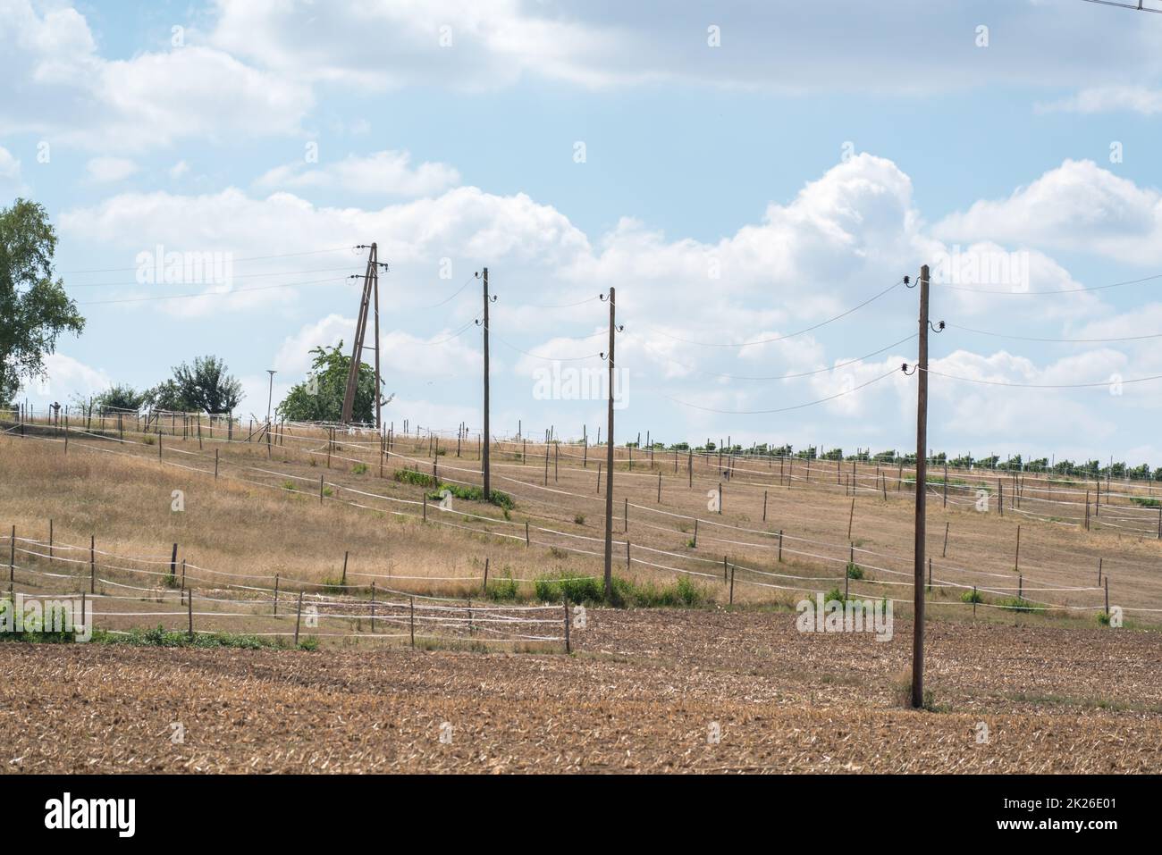 Older wooden overhead power transmission line across the landscape ...