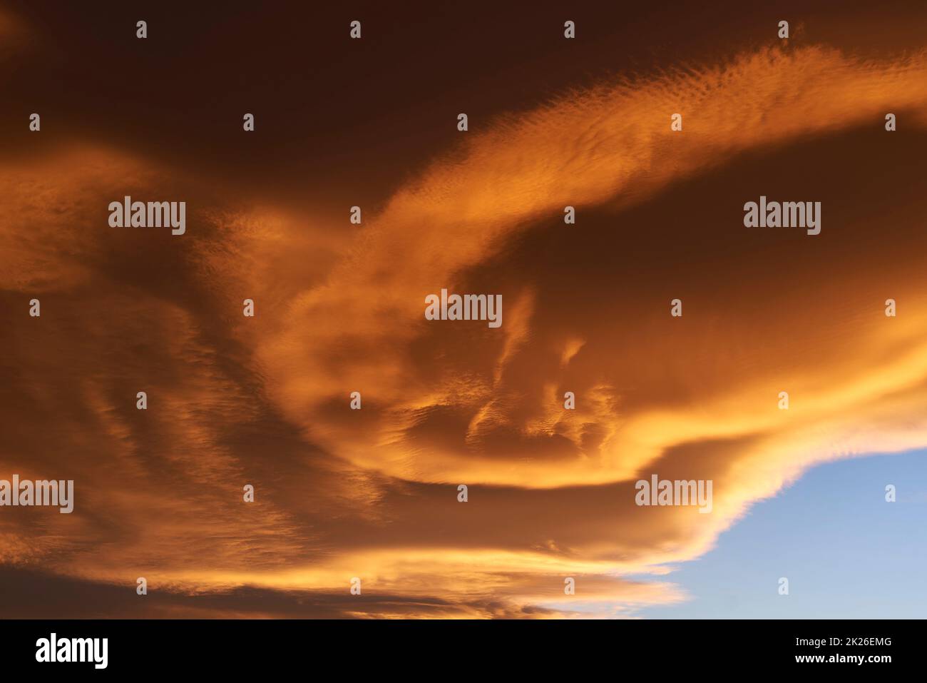 Sky light after sunset. orange background, clouds Stock Photo - Alamy
