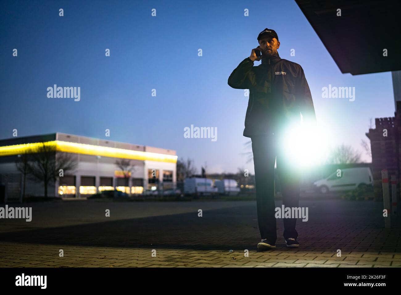 Security Guard Walking Building Perimeter With Flashlight Stock Photo ...