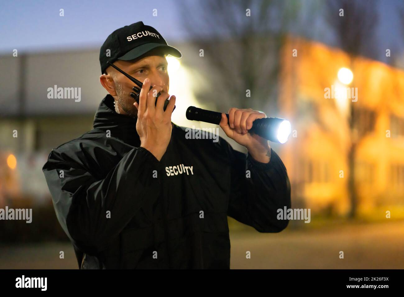 Security Guard Walking With Flashlight At Night Stock Photo - Alamy