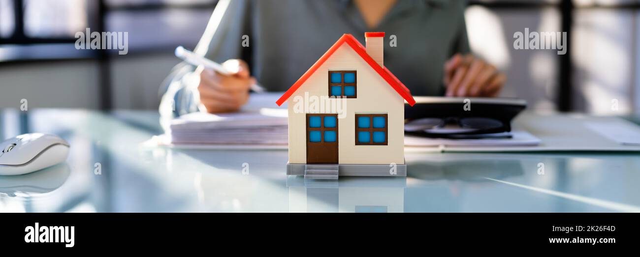 Person Hand Doing Property Tax Calculation Using Calculator Stock Photo ...