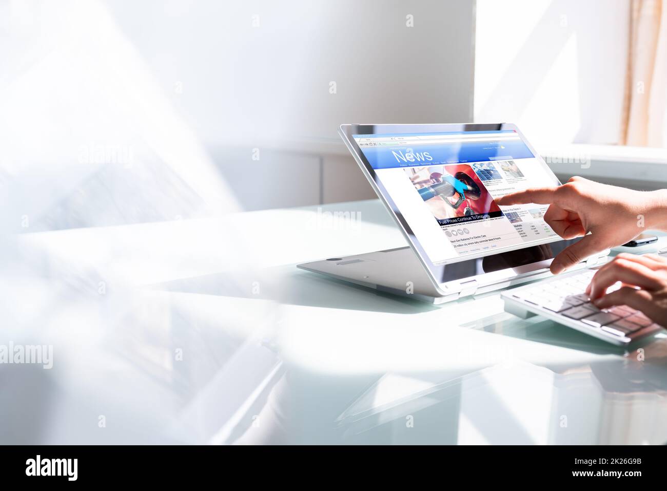 Watching News On Tablet Computer Screen Stock Photo - Alamy