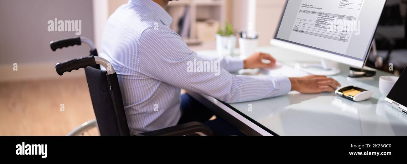 African Accountant With Disability Working On Computer Stock Photo - Alamy