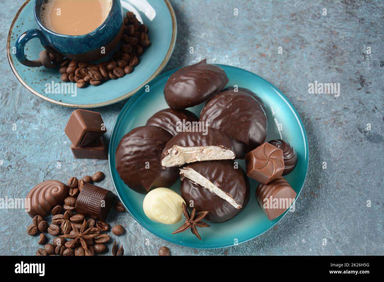 Zefir (zephyr),coffee cup, beans, chocolate on kitchen table Assortment ...