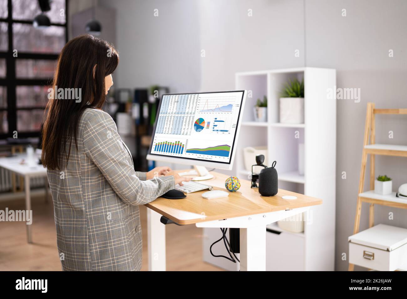 Adjustable Height Desk Stand In Office Stock Photo - Alamy