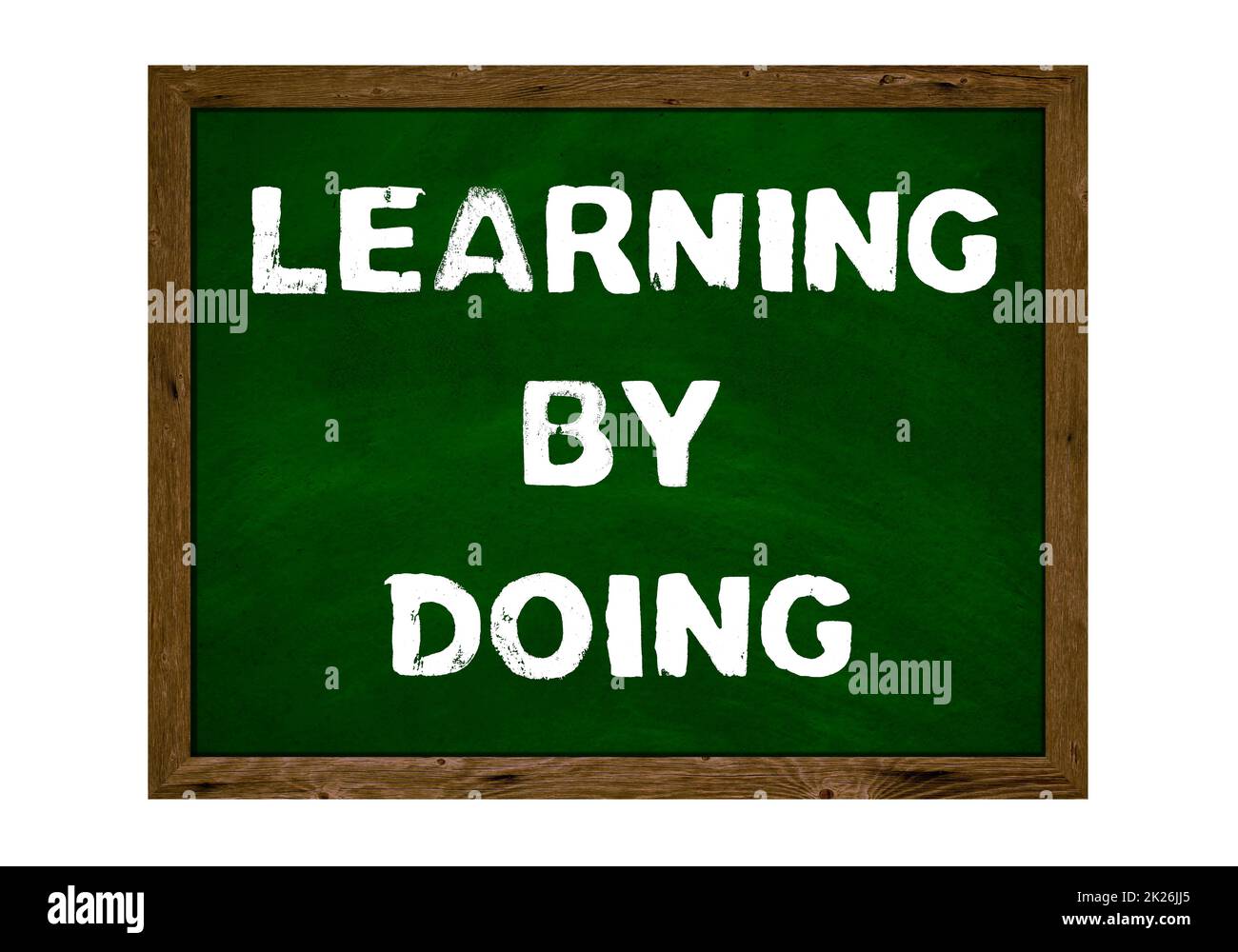 Learning by Doing - Green chalkboard background Stock Photo - Alamy
