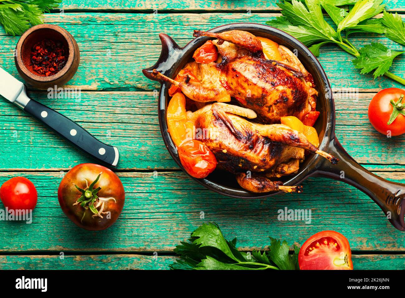 Quail roasted in tomatoes Stock Photo - Alamy