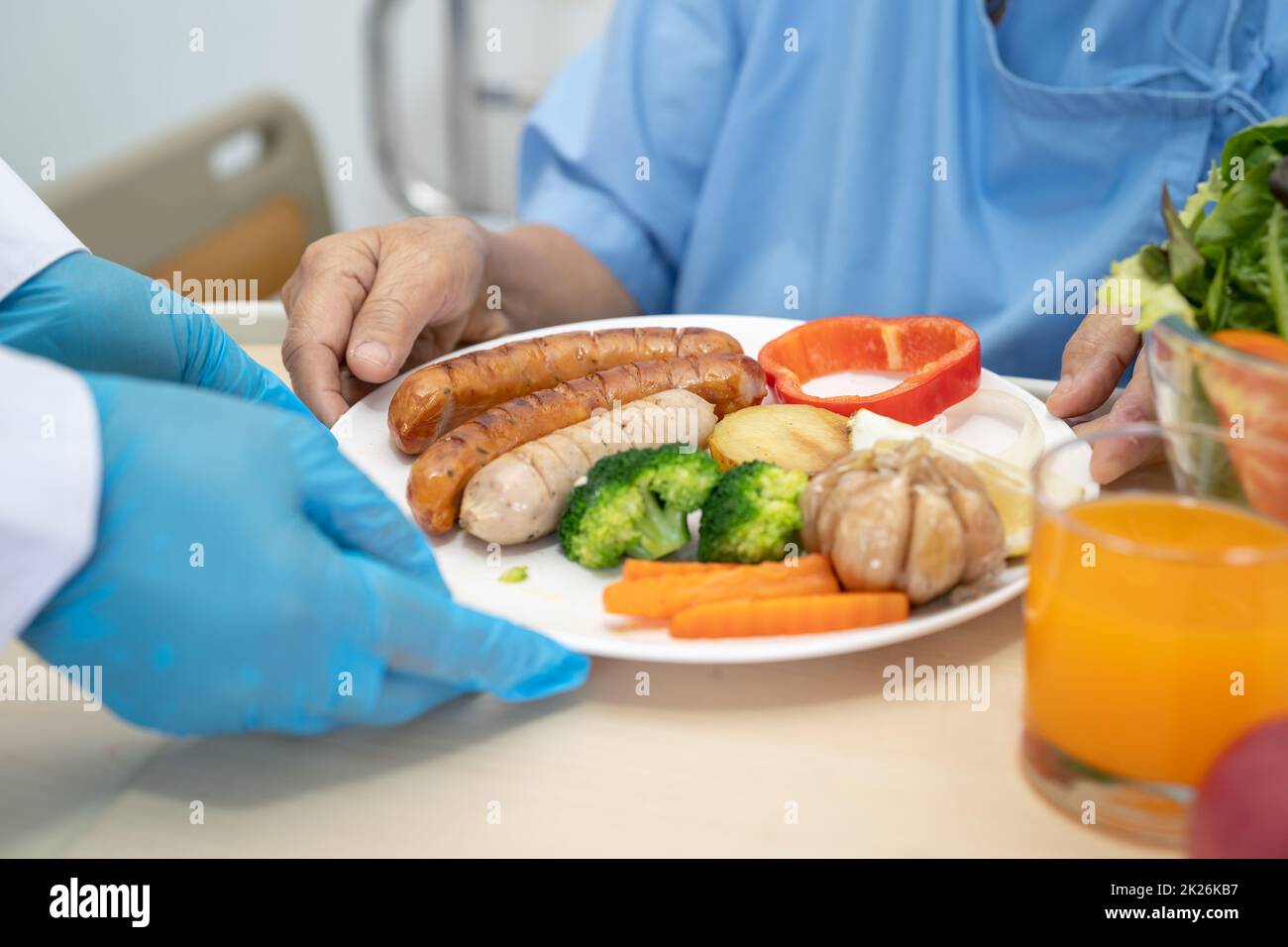 Asian senior or elderly old lady woman patient eating breakfast and ...