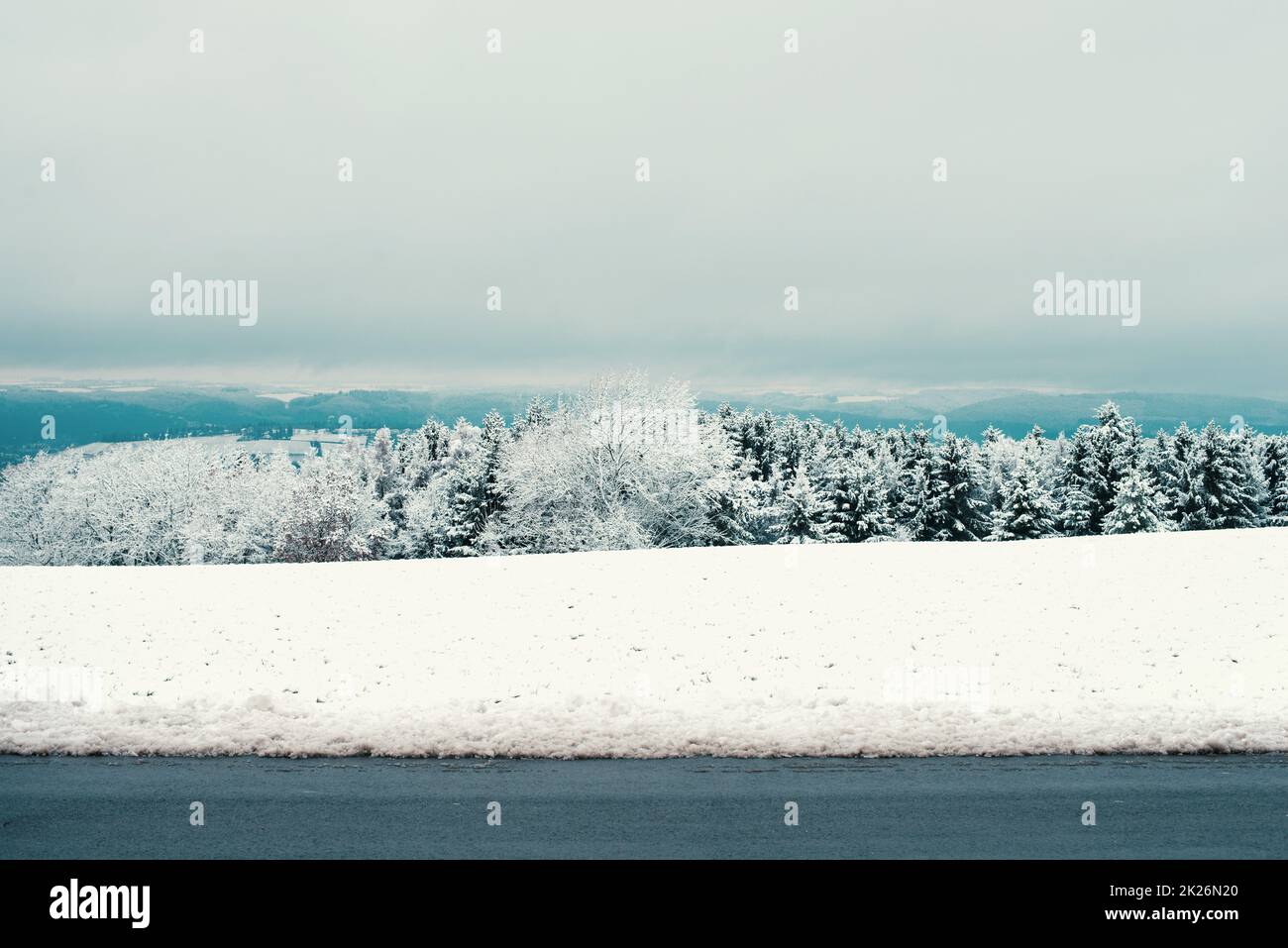 Landscape in the snow, wintertime in Germany, forest and mountains ...