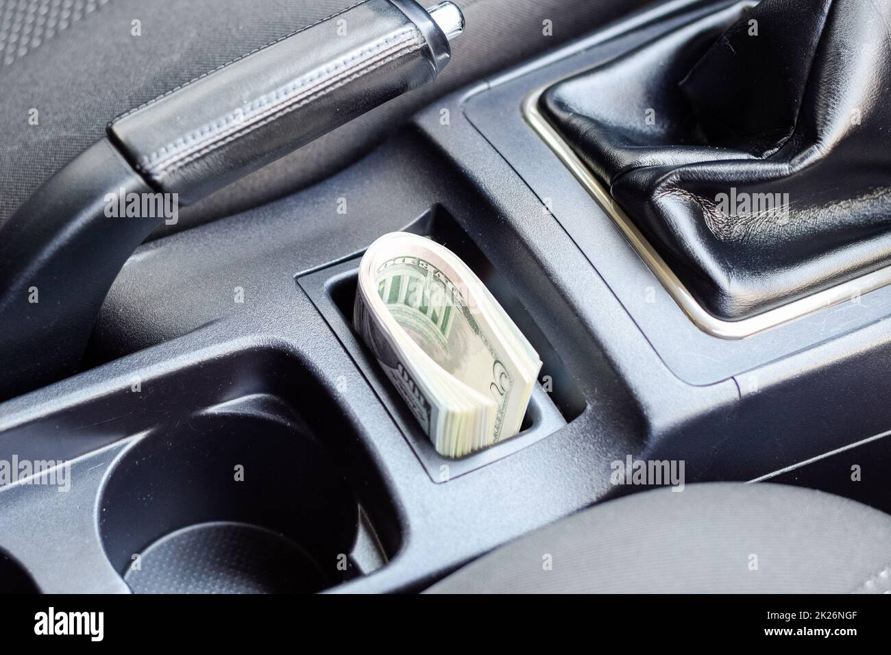 wad of dollars inside the car Stock Photo - Alamy