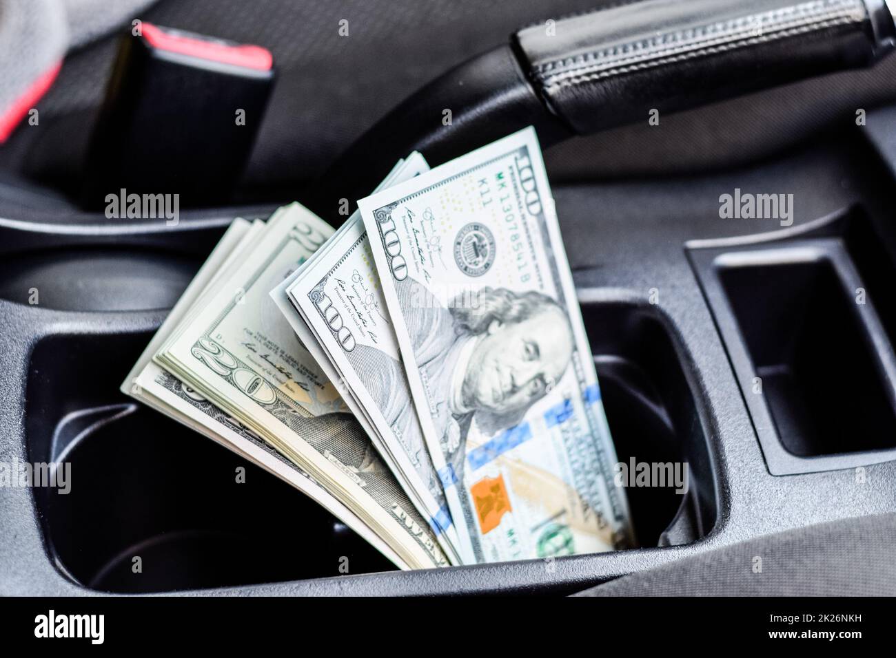 wad of dollars inside the car Stock Photo - Alamy