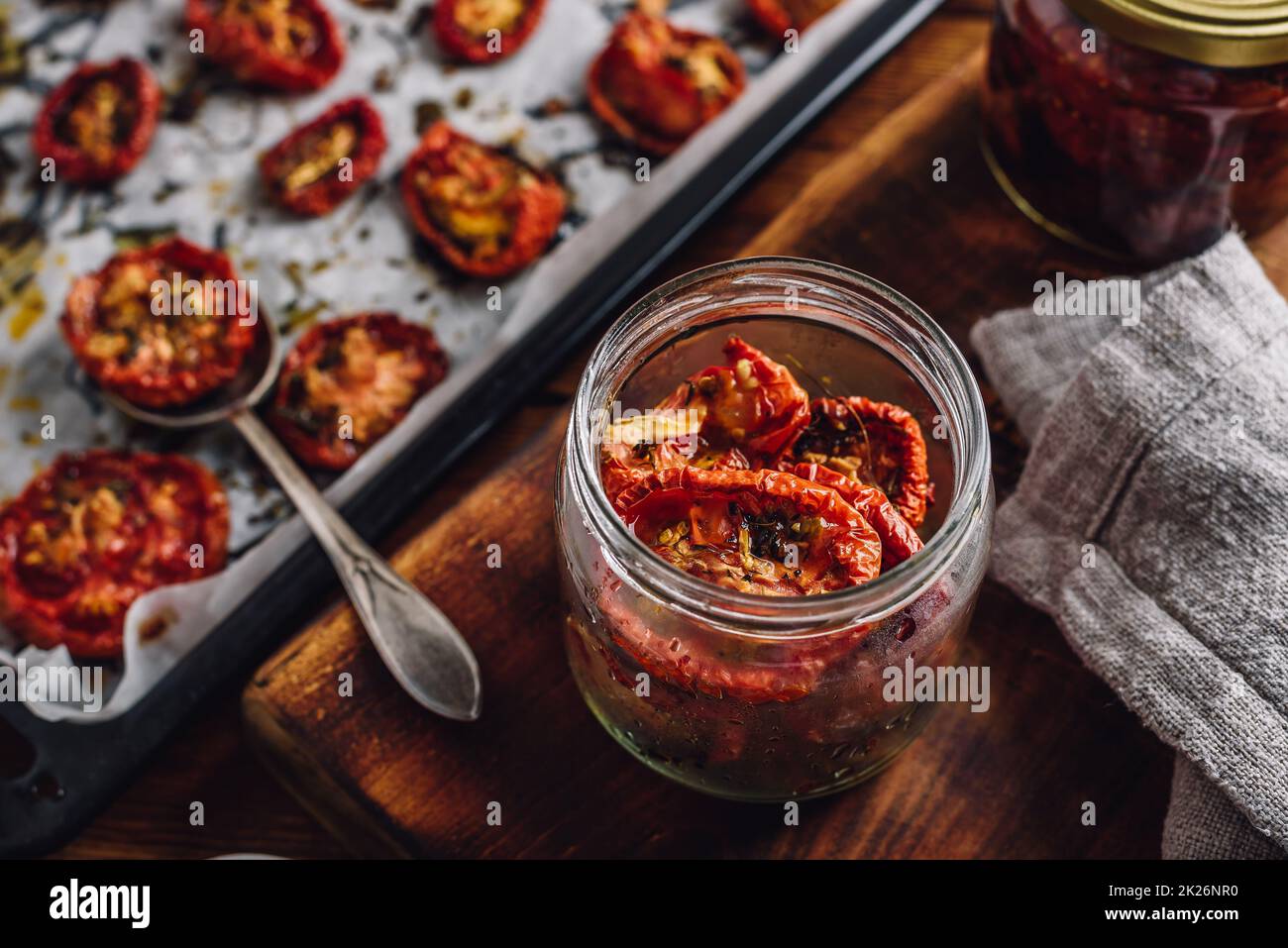 Oven Baked Tomatoes with Oregano in a Glass Jar Stock Photo - Alamy