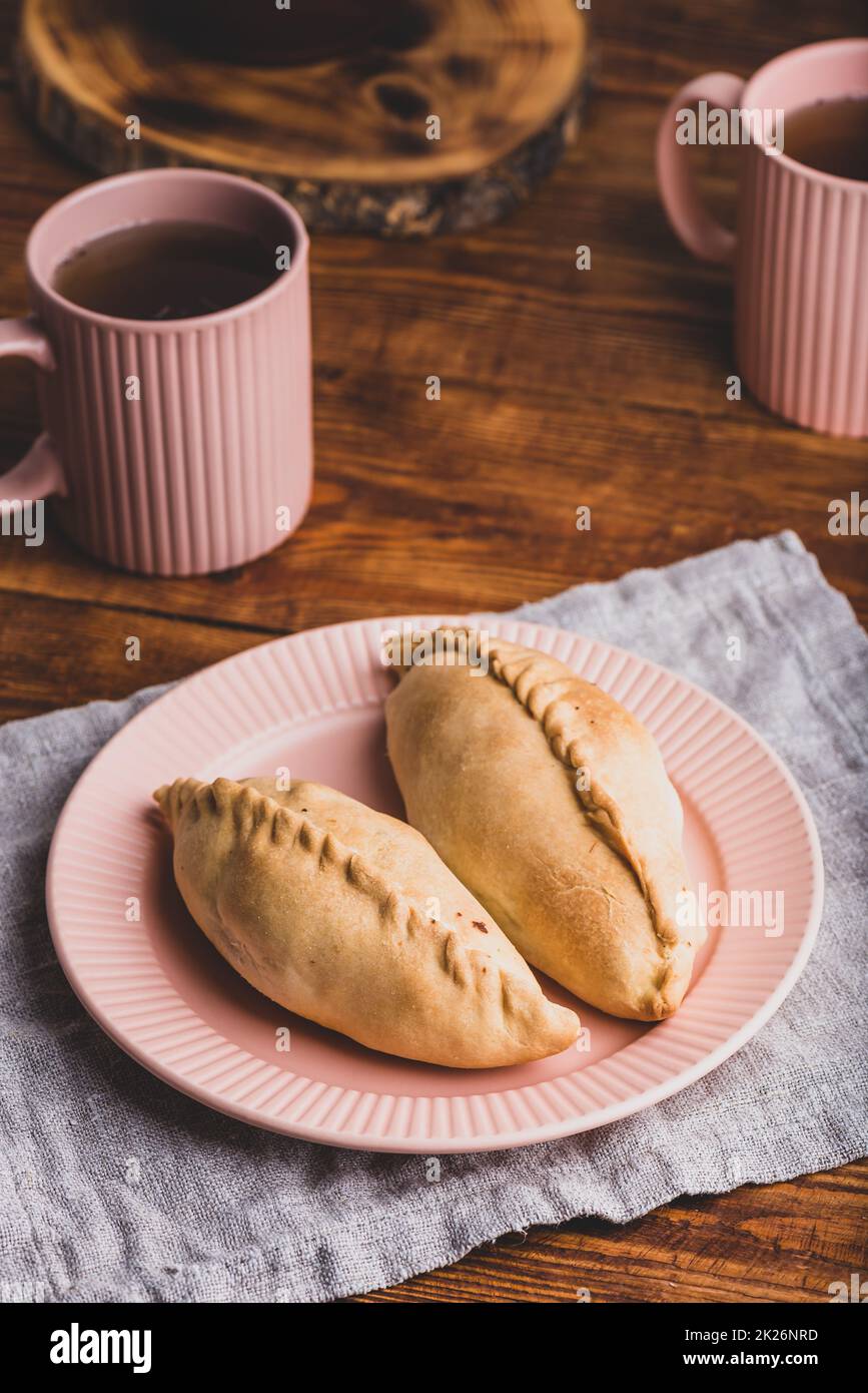 Two Cabbage Hand Pies on Plate Stock Photo - Alamy