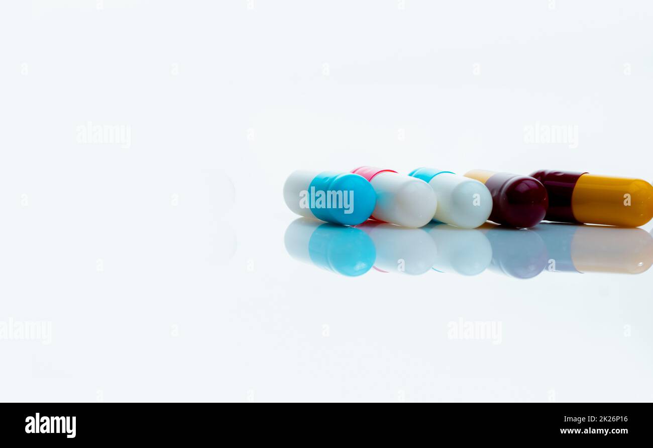 Antibiotic capsule pills on white background. Prescription drugs ...
