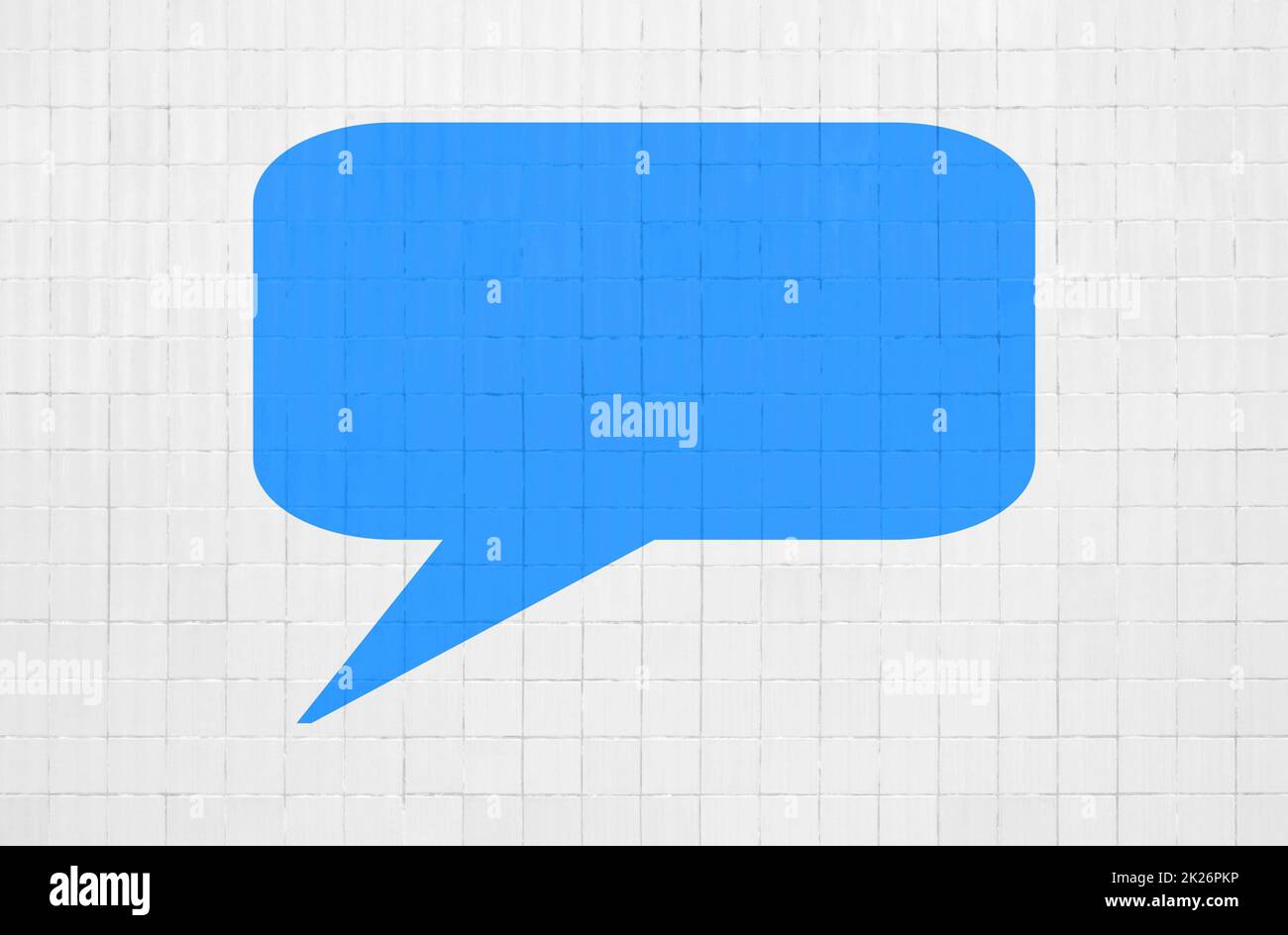 Blue speech bubble on white wall with tiles Stock Photo - Alamy