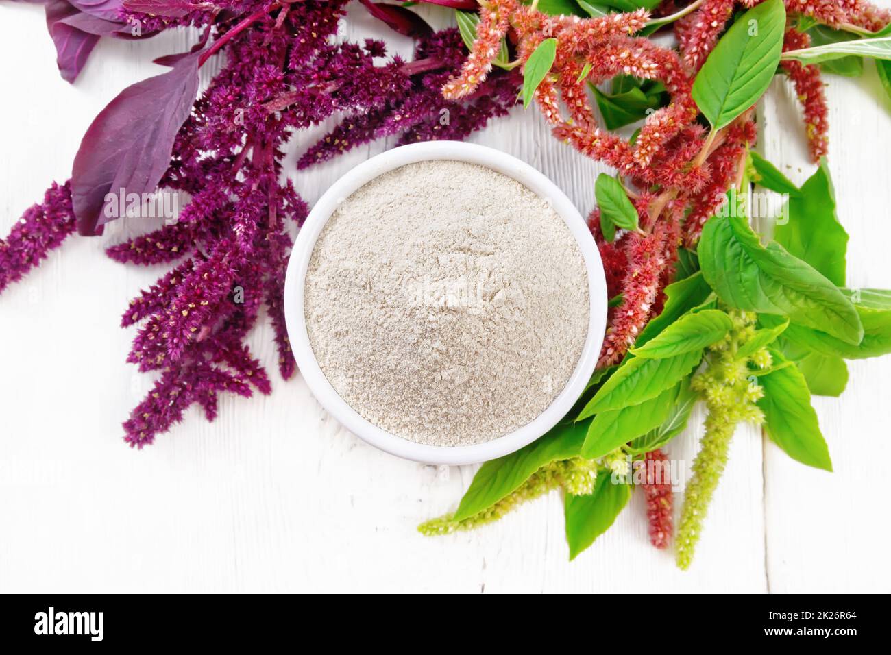 Flour amaranth in bowl on board top Stock Photo - Alamy