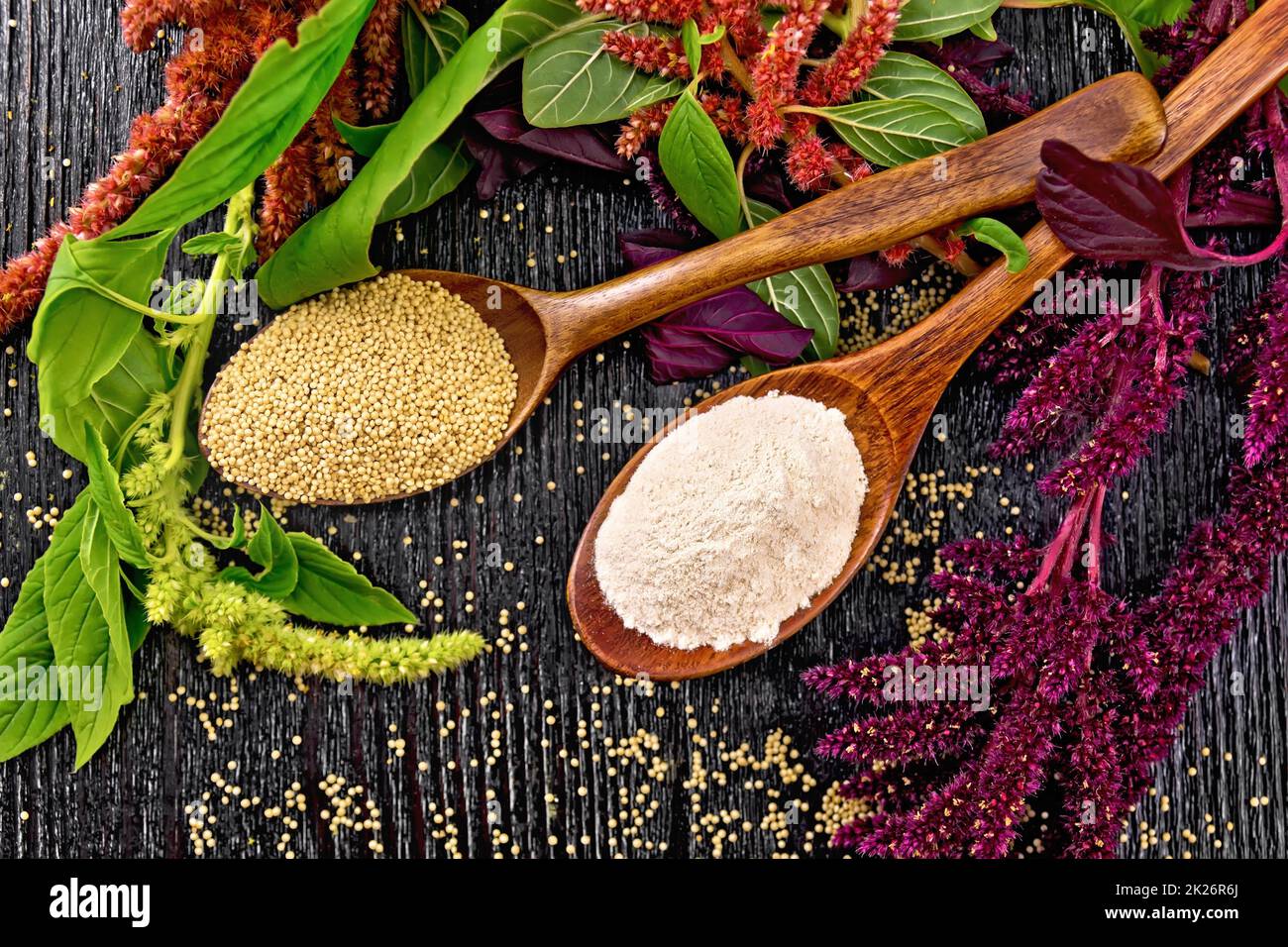 Flour and seeds amaranth in two spoons on board top Stock Photo - Alamy