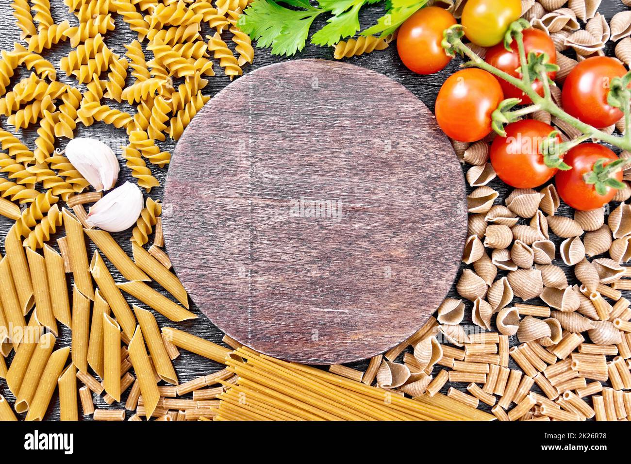 Frame different whole grain and rye pasta on dark board Stock Photo - Alamy