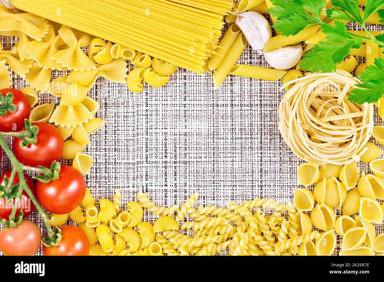 Frame of pasta on coarse woven fabric Stock Photo - Alamy