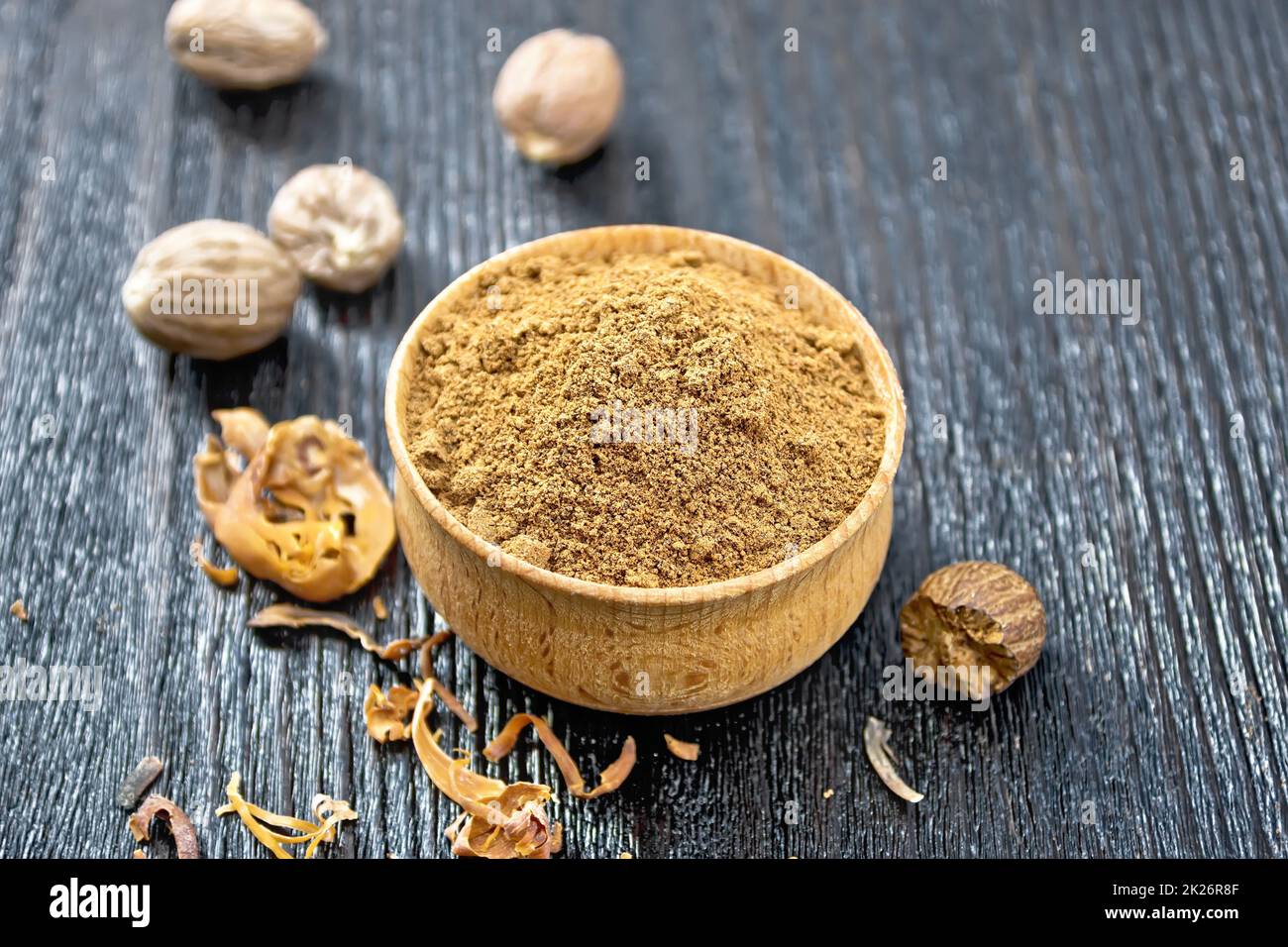 Nutmeg in wooden bowl hi-res stock photography and images - Alamy