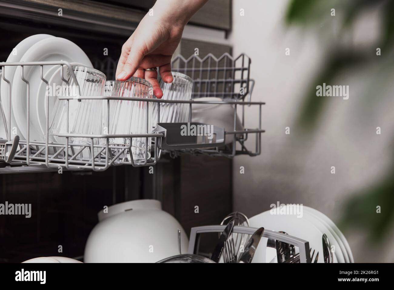 Washing dishes in modern kitchen hi-res stock photography and images ...