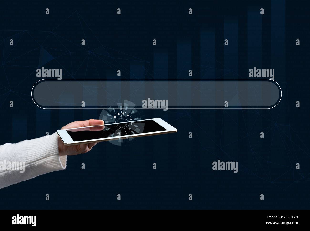 a female hand holds a tablet over the information search input line ...