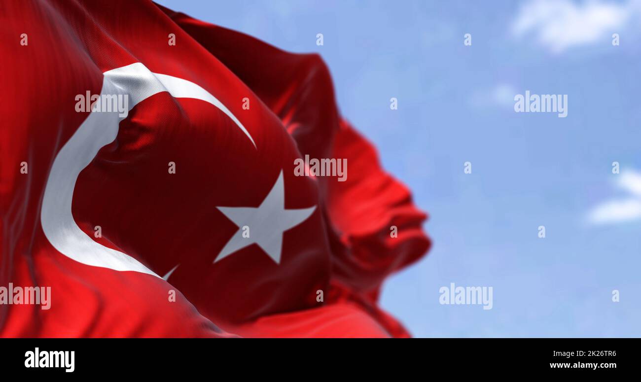 Detail of the national flag of Turkey waving in the wind on a clear day ...