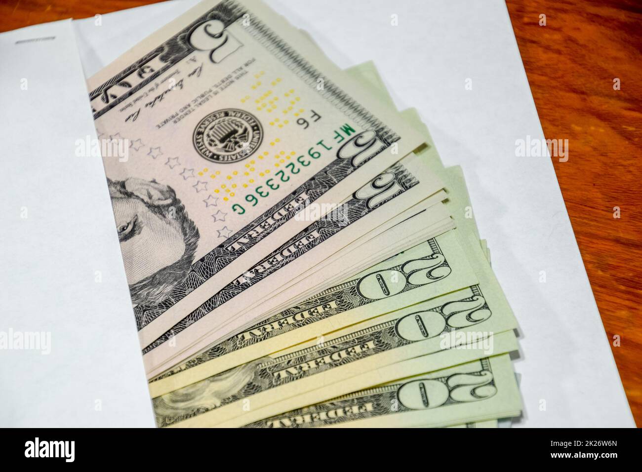 Dollars on table with an envelope. Money in an envelope. U.S. dollars ...