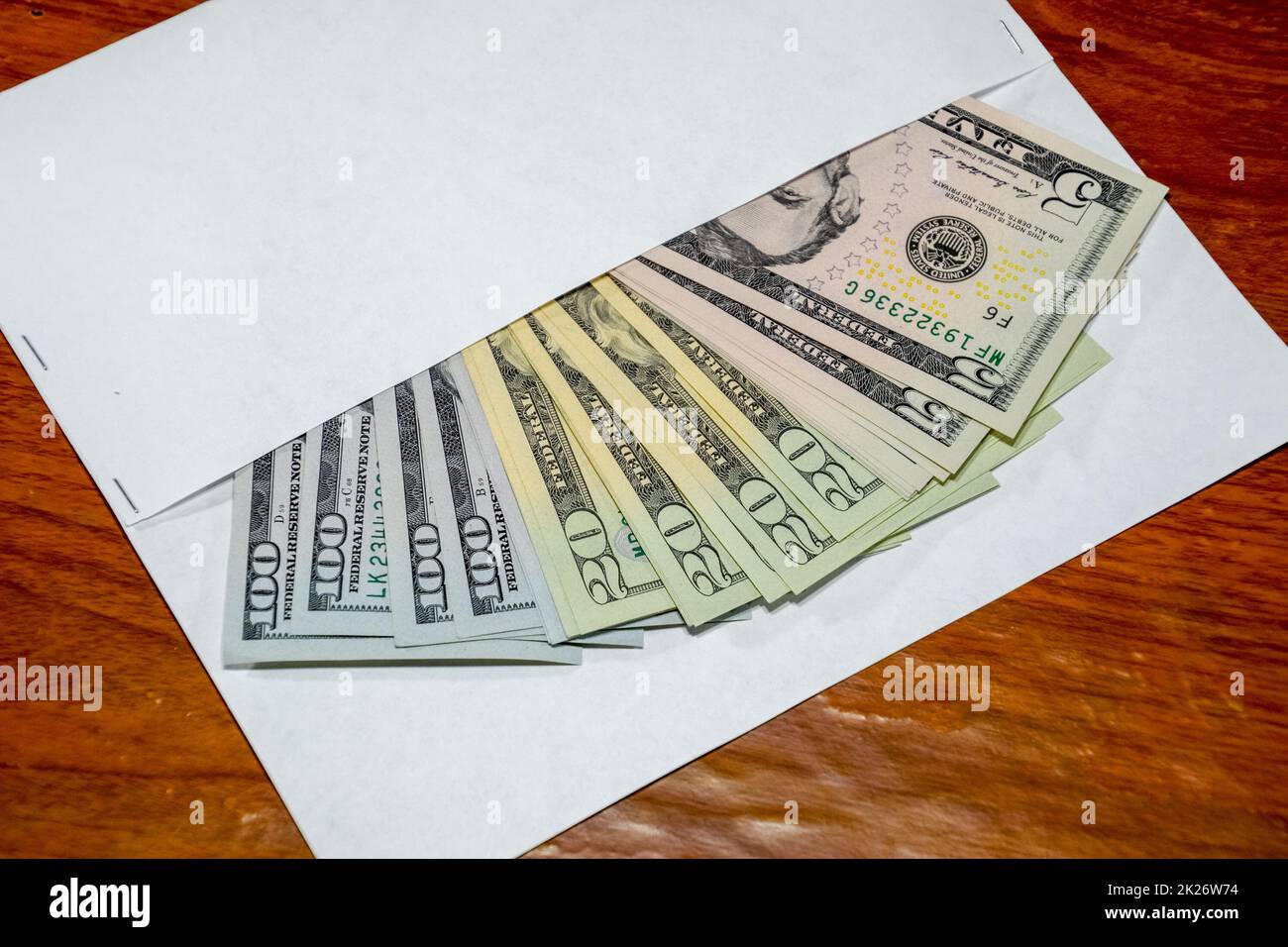 Dollars on table with an envelope. Money in an envelope. U.S. dollars ...