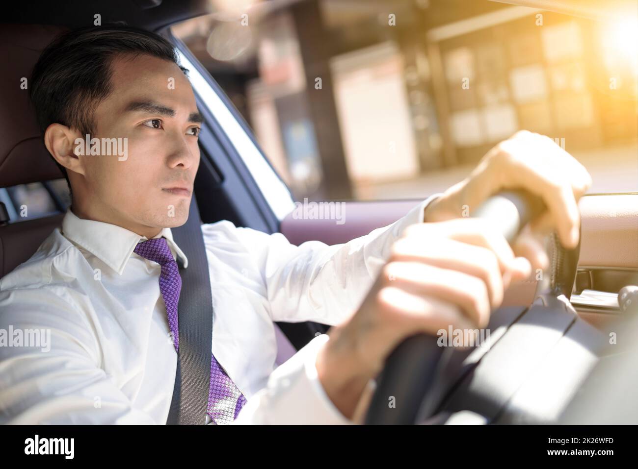 Young chinese man driving car hi-res stock photography and images - Alamy