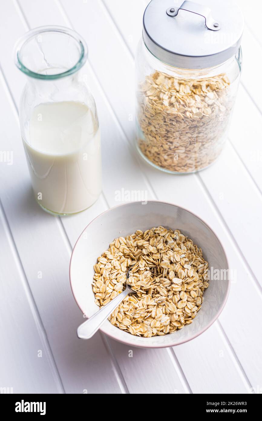 Breakfast cereals. Uncooked oatmeal. Raw oat flakes Stock Photo - Alamy