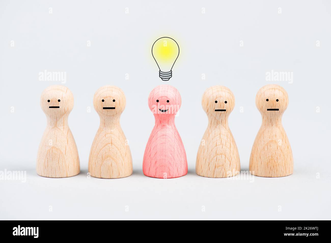 Group of people standing together, one has an idea, light bulb over a ...