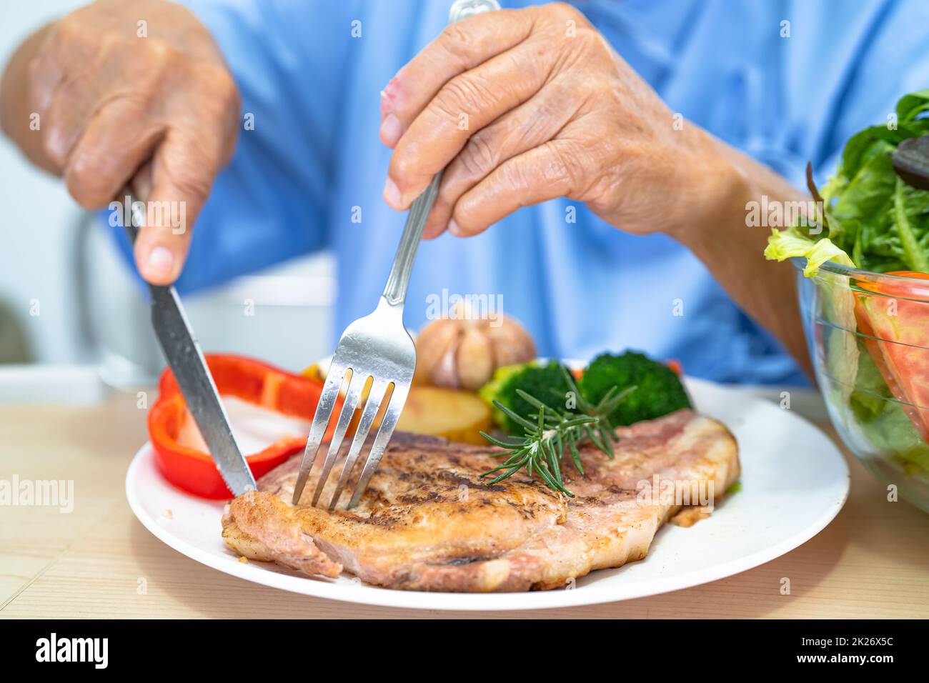 Asian senior or elderly old lady woman patient eating breakfast and ...