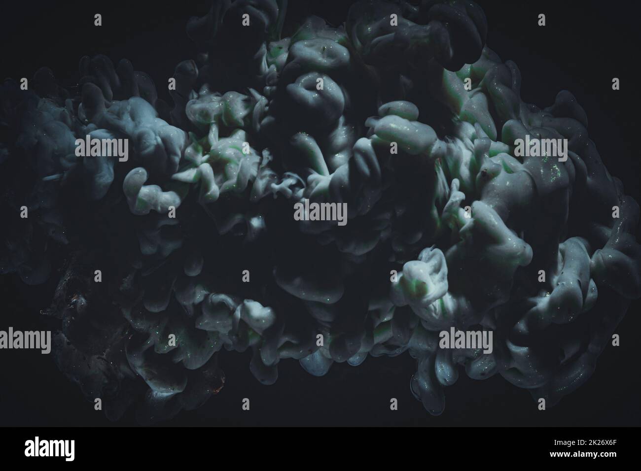 blue and light blue ink that creates a cloud of color Stock Photo - Alamy