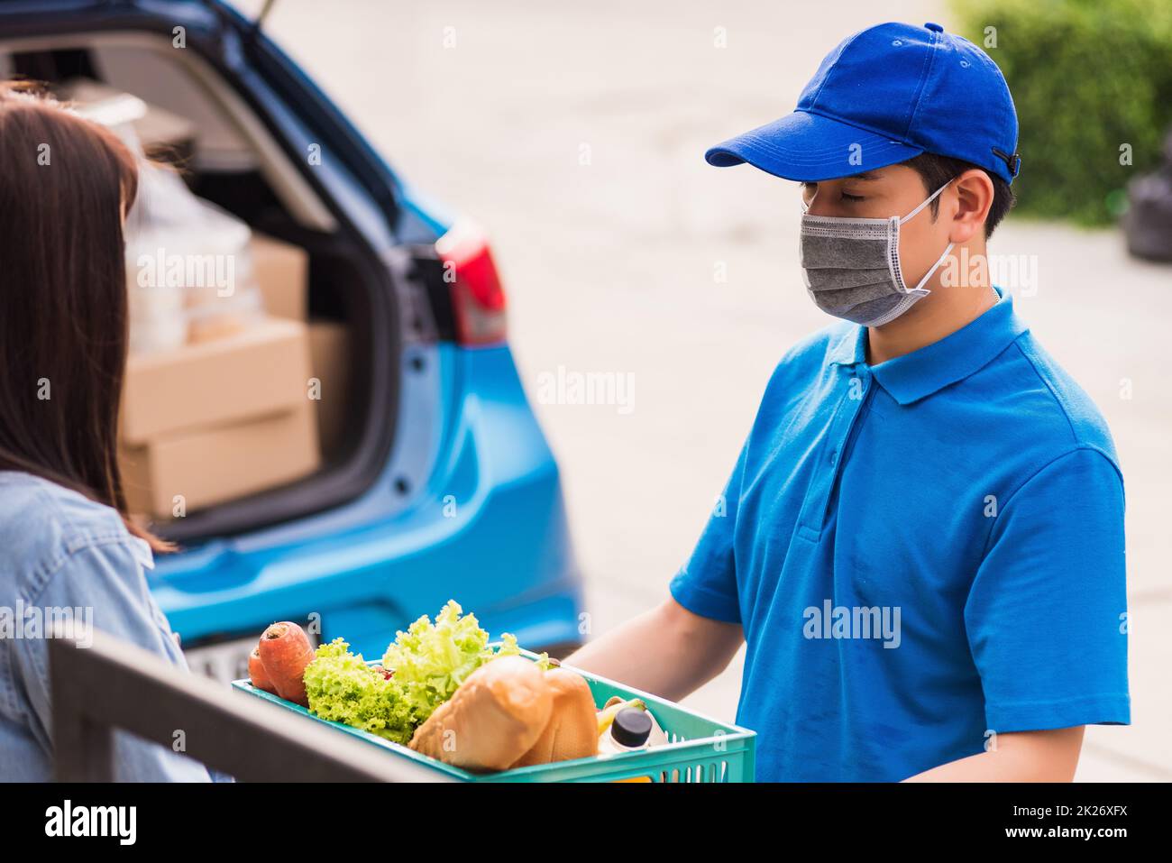 Delivery man wear face mask grocery fast service giving fresh food ...