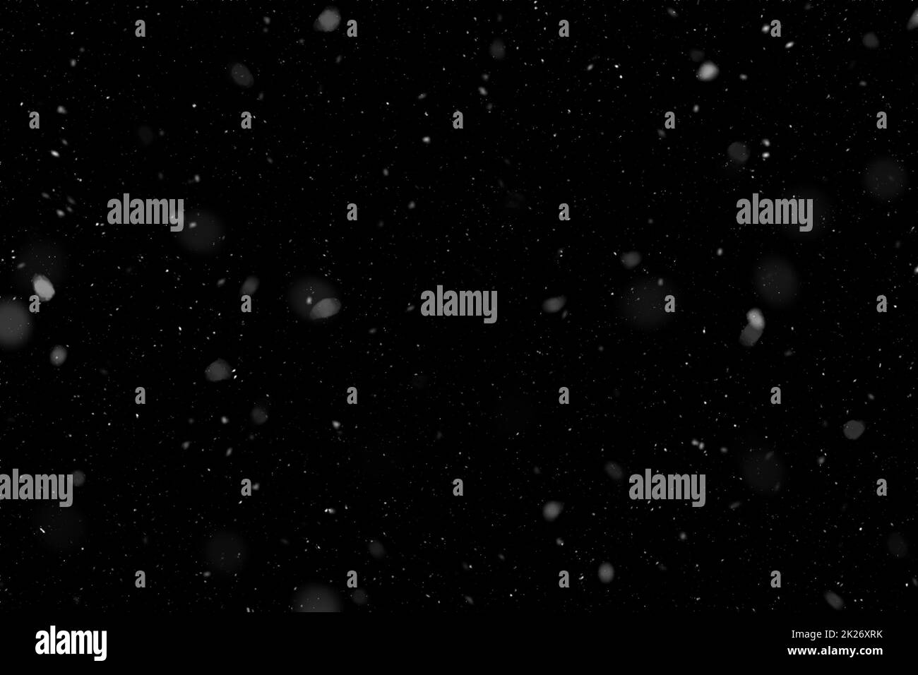 Real falling snow on a black background Stock Photo - Alamy