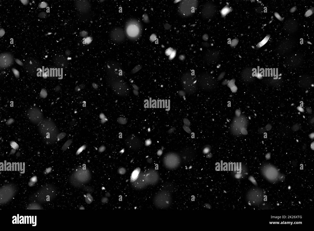 Real falling snow on a black background Stock Photo - Alamy