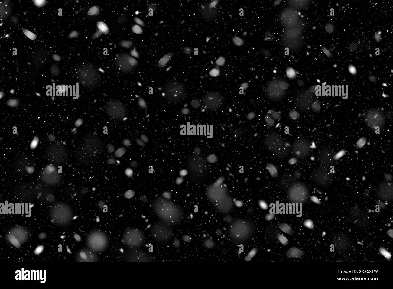 Real falling snow on a black background Stock Photo - Alamy