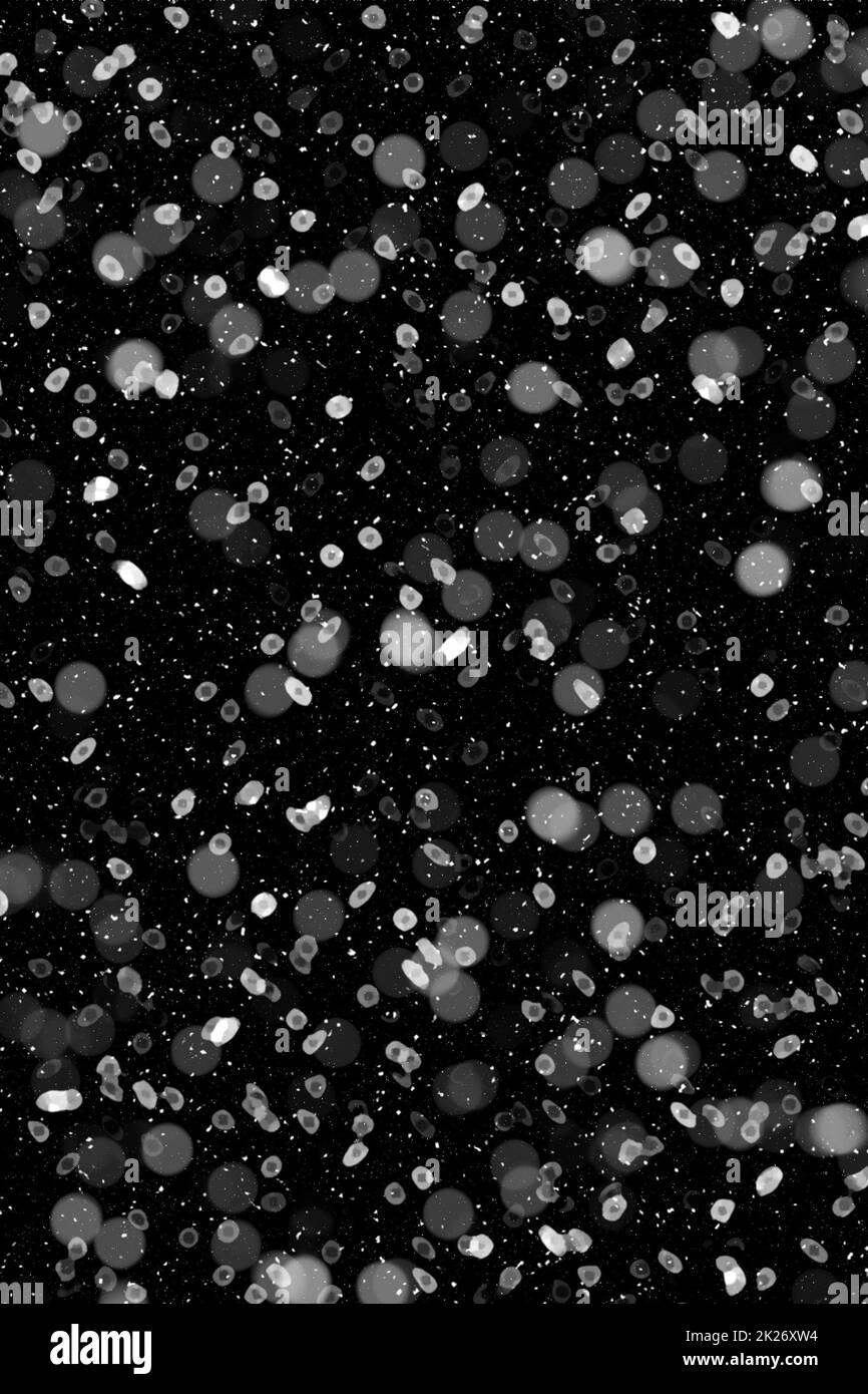Real falling snow on a black background Stock Photo - Alamy