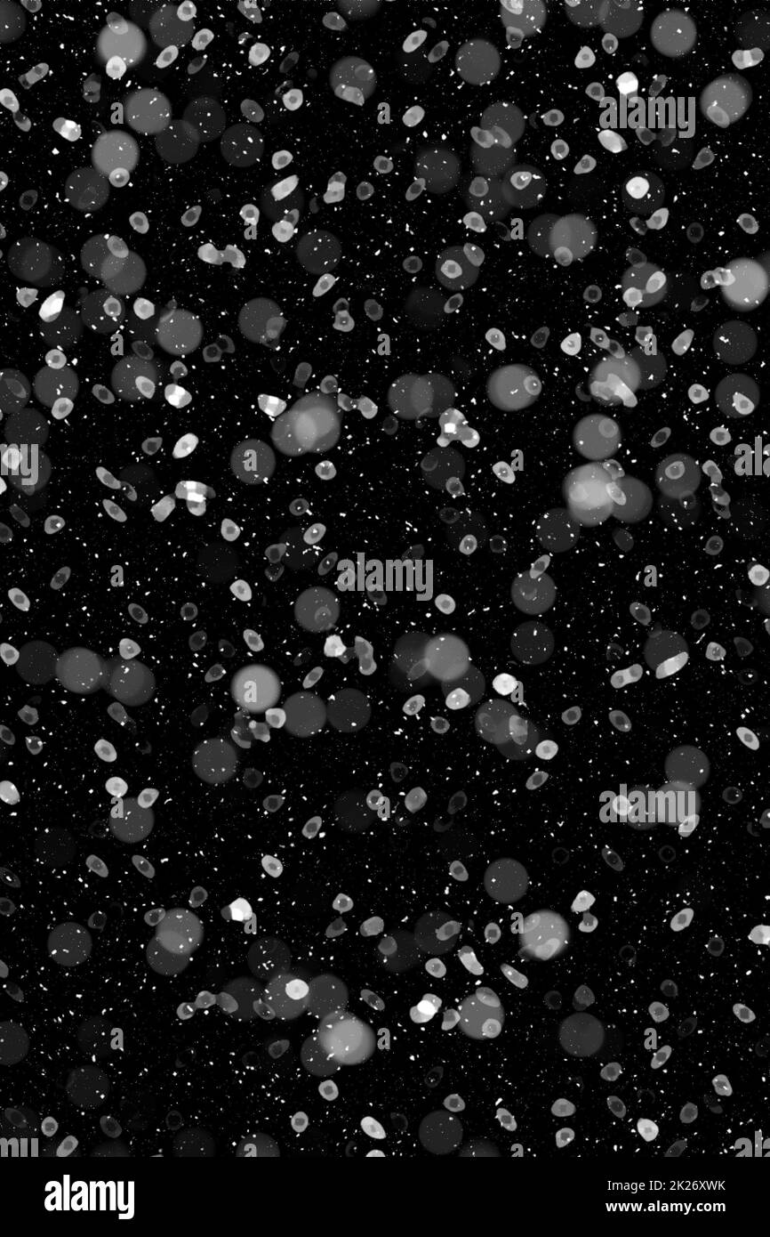 Real falling snow on a black background Stock Photo - Alamy