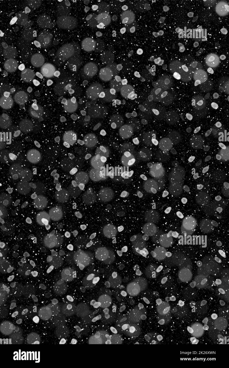 Real falling snow on a black background Stock Photo - Alamy