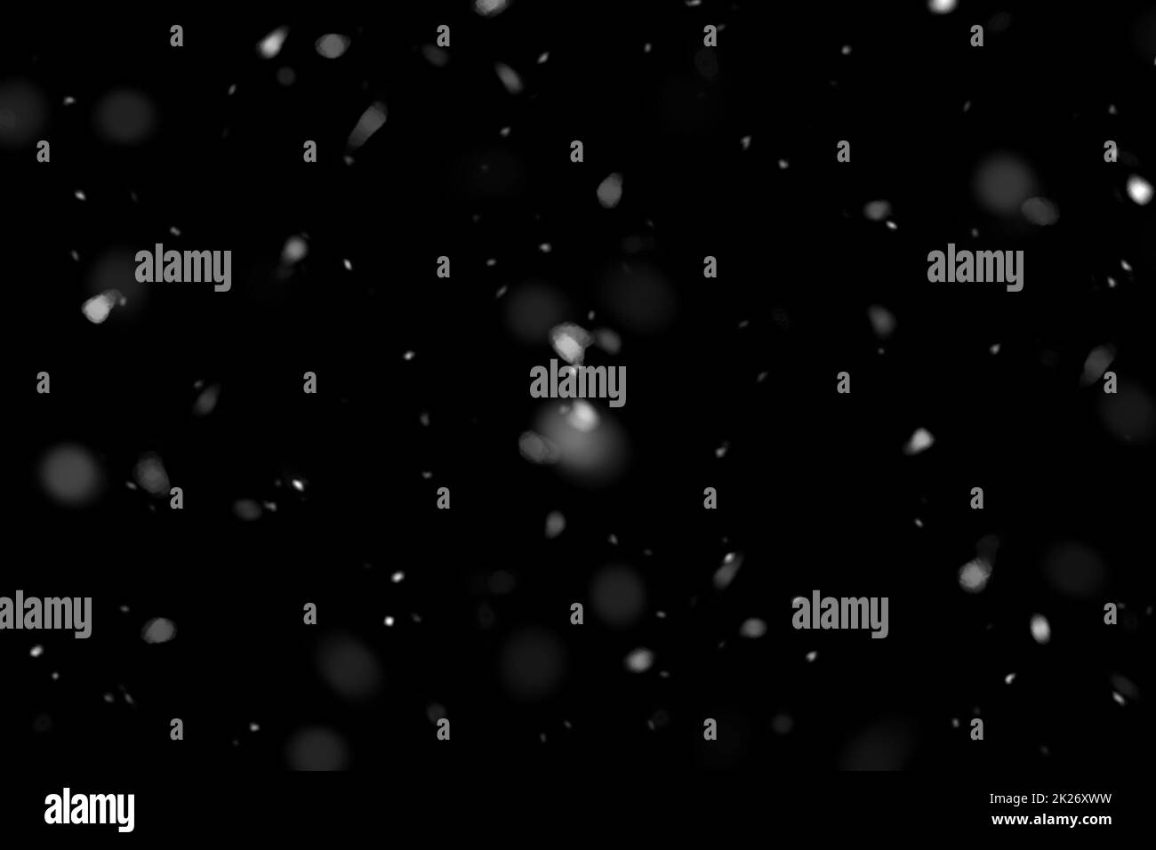 Real falling snow on a black background Stock Photo - Alamy