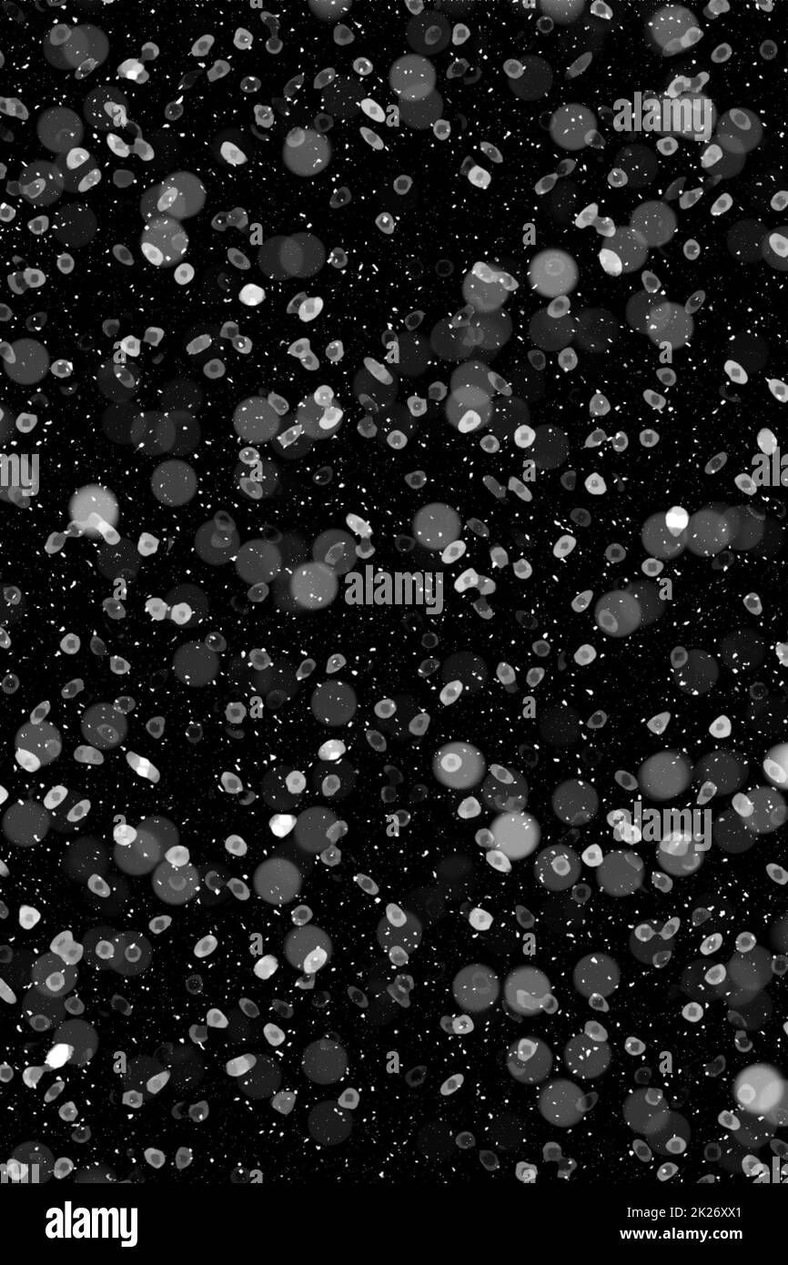 Real falling snow on a black background Stock Photo - Alamy