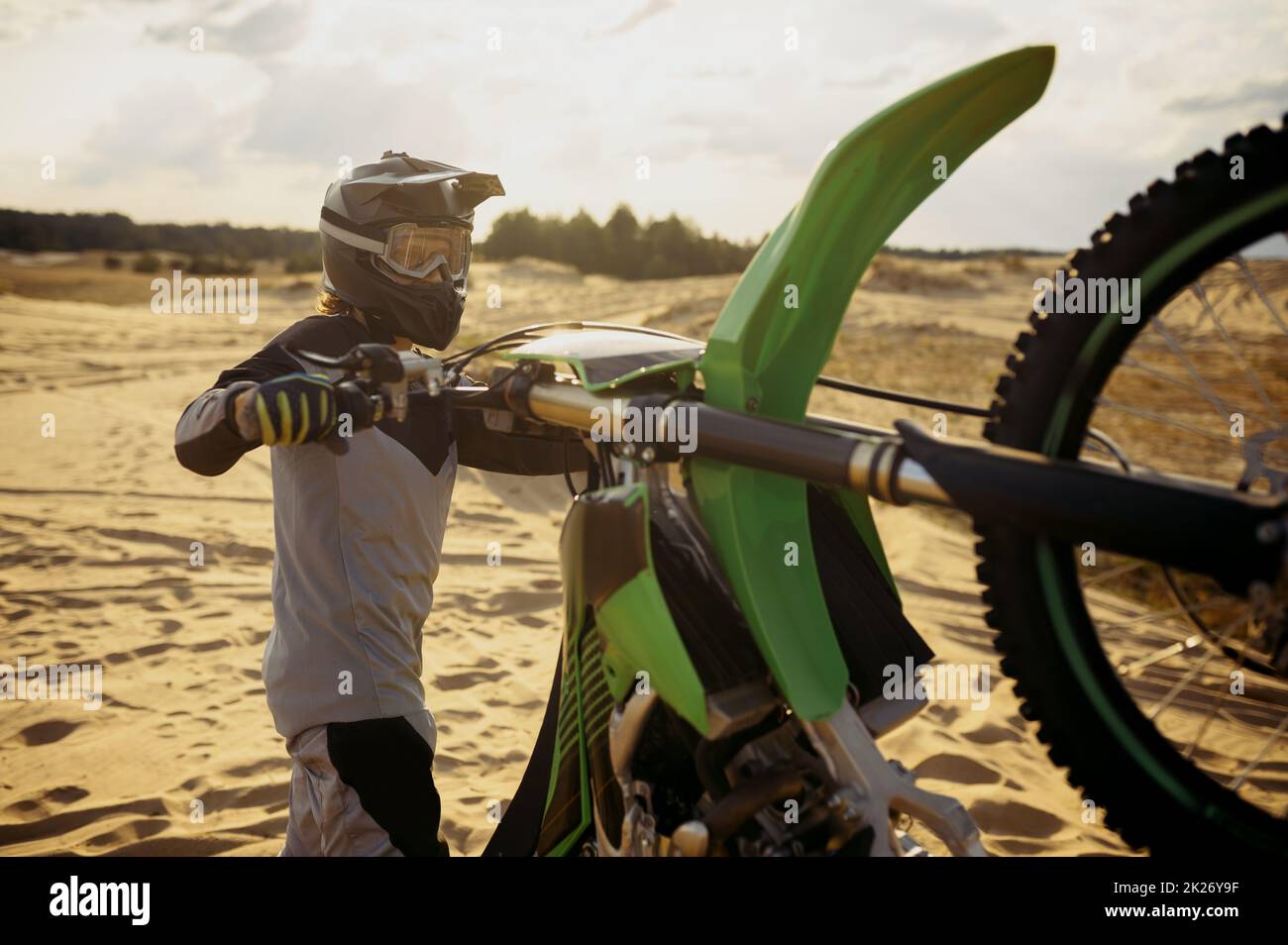 Extreme motocross rider riding on dirt track Stock Photo - Alamy