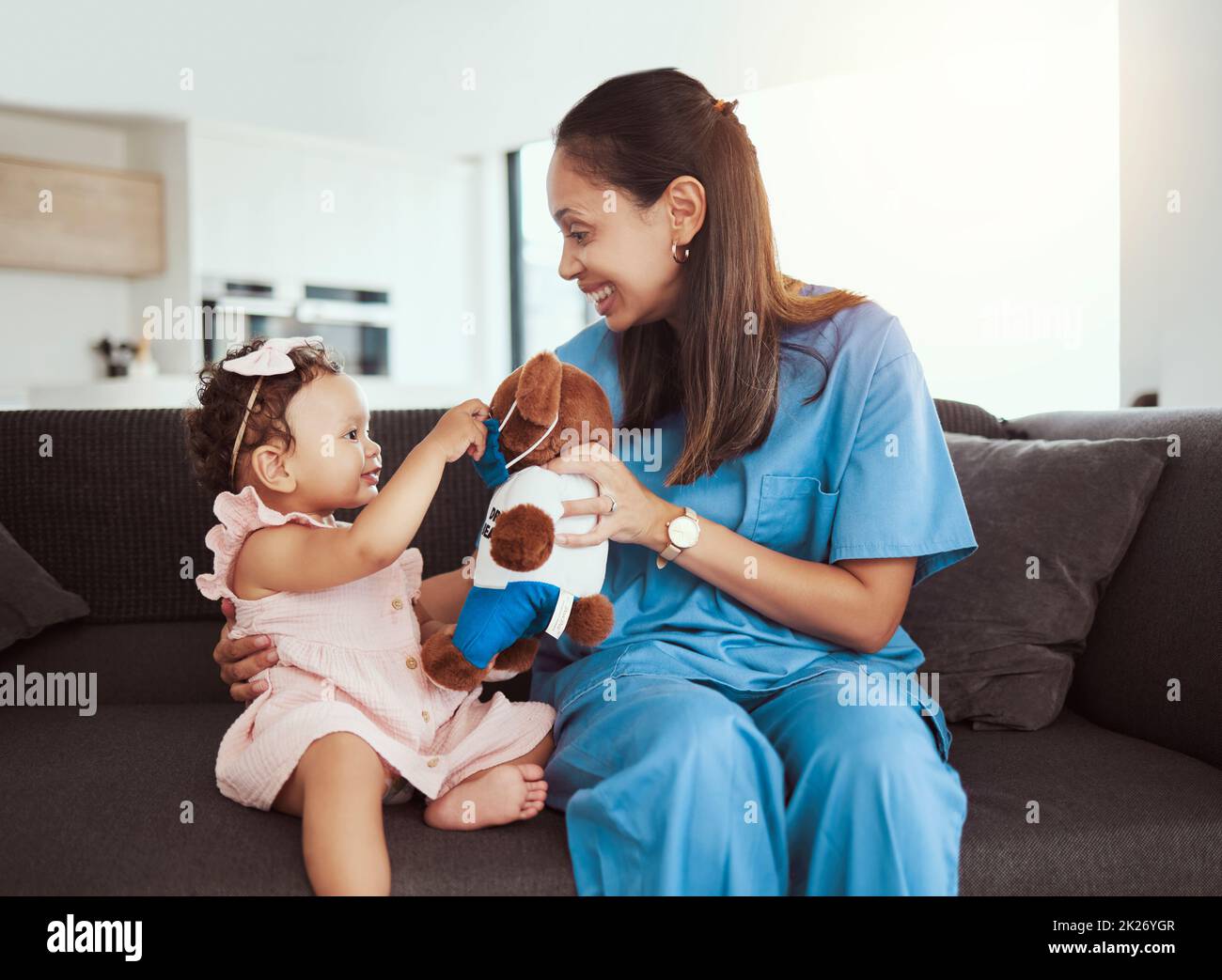 Pediatrician doctor consulting kid, teddy bear and happy healthcare ...